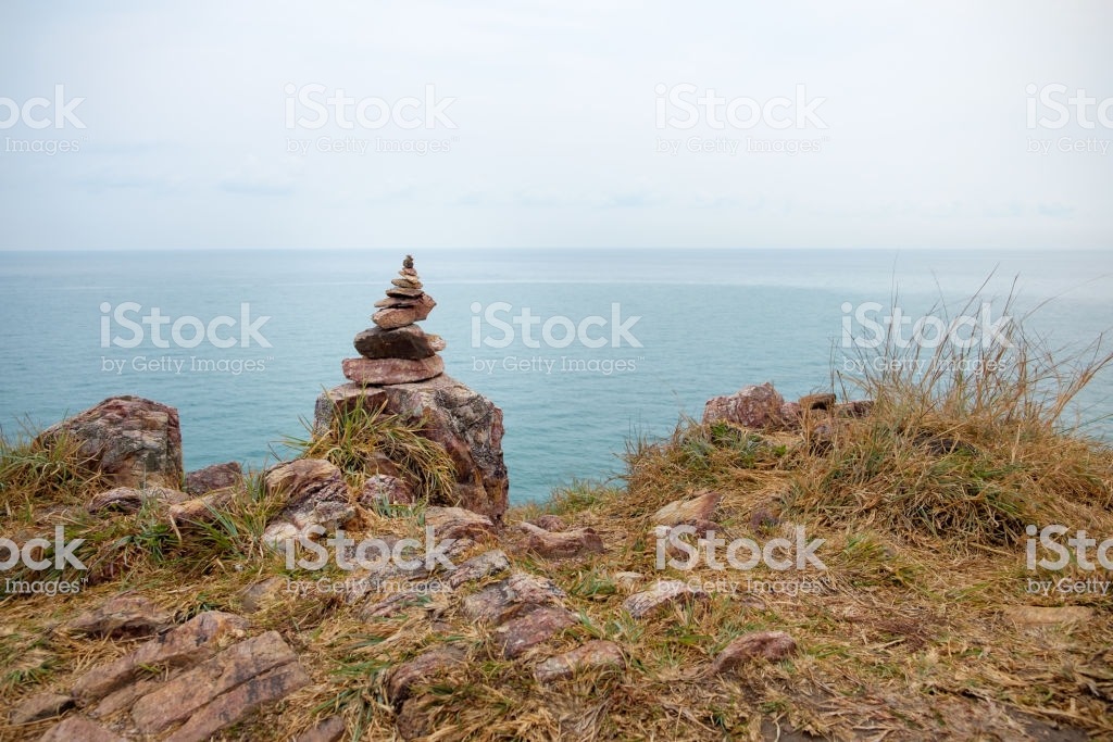 Free download Balance Stone Stack On Cliffside With Seascape Background ...