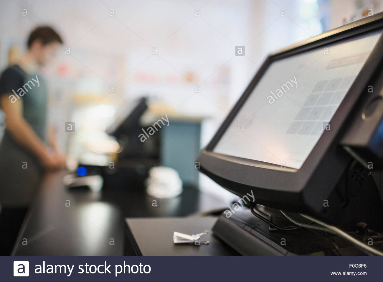 🔥 Download Close Up Of Checkout Counter With Cashier In Background At ...